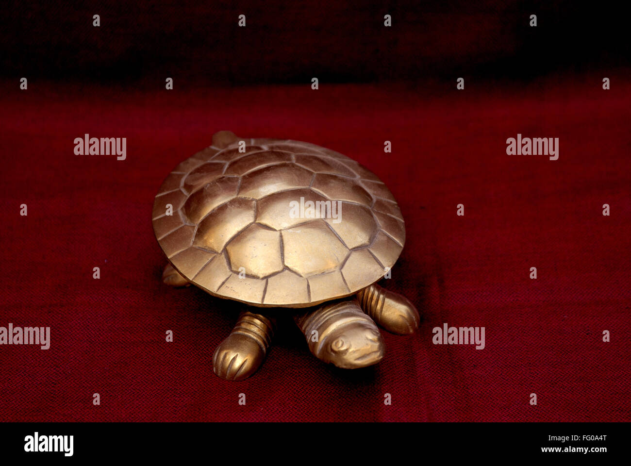 Brass statue of turtle on red background , Maharashtra , India Stock ...
