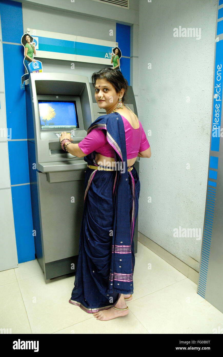 Lady using ATM card for withdraw cash from savings account at Maim ...