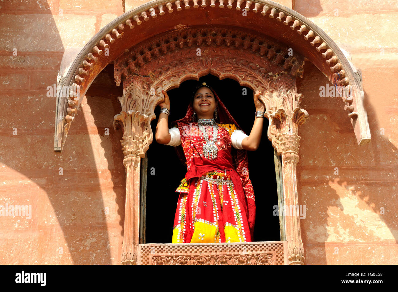 Rajasthani lady looking through jharoka ; Rajasthan ; India MR#769C ...