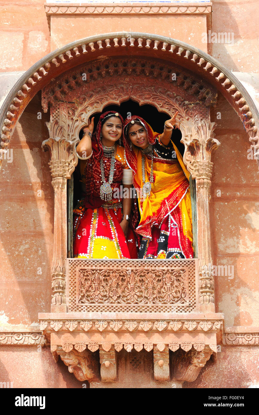 Rajasthani ladies looking through jharoka ; Rajasthan ; India MR#769D ...