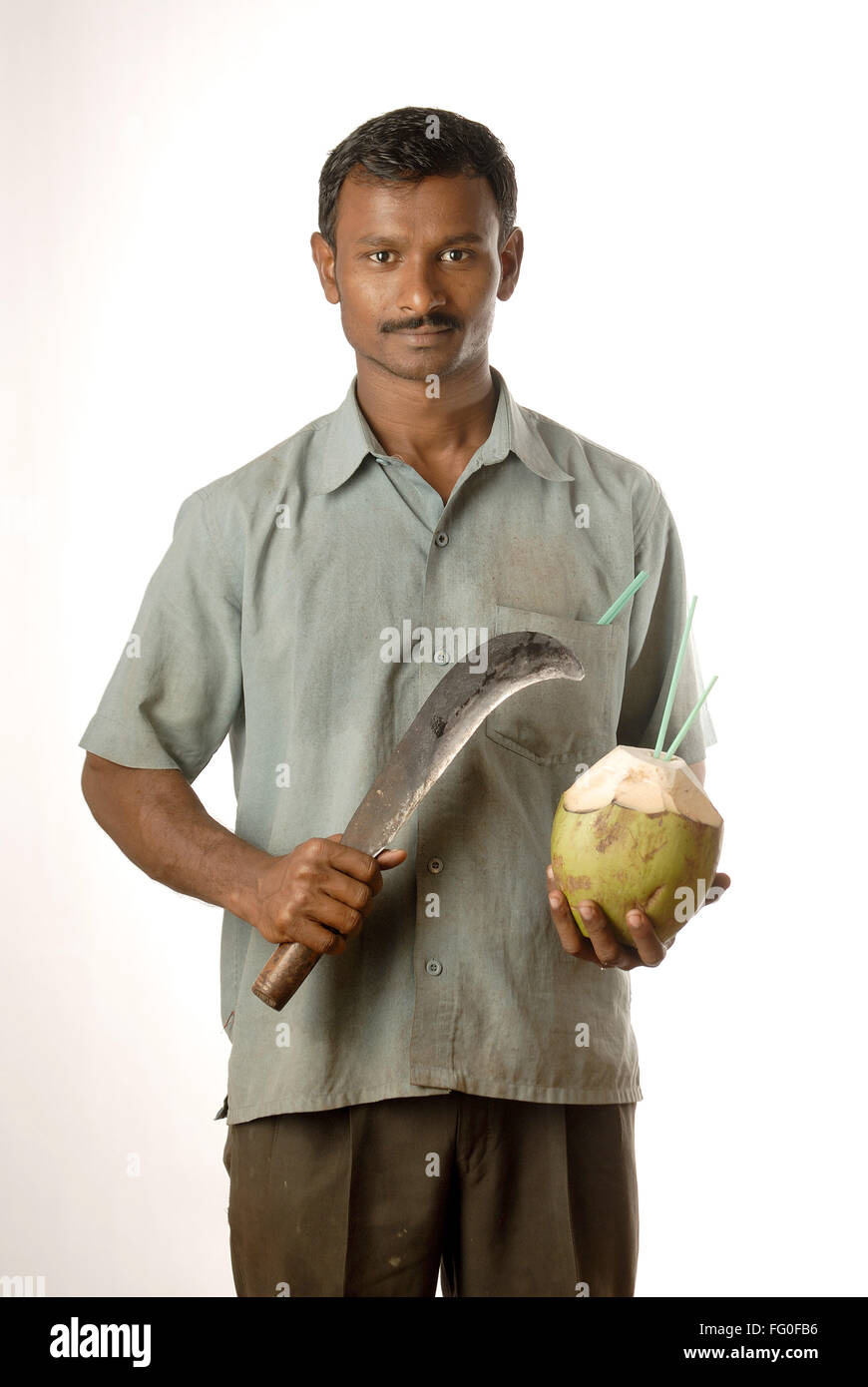 Indian man profession coconut vendor with coconut & sickle in hand MR ...