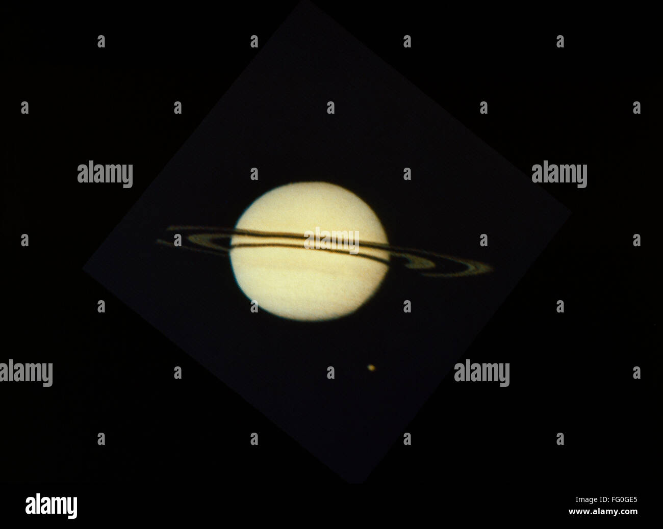 SATURN. /nThe planet Saturn and an orbiting moon, photographed by a NASA spacecraft, c1980 Stock ...