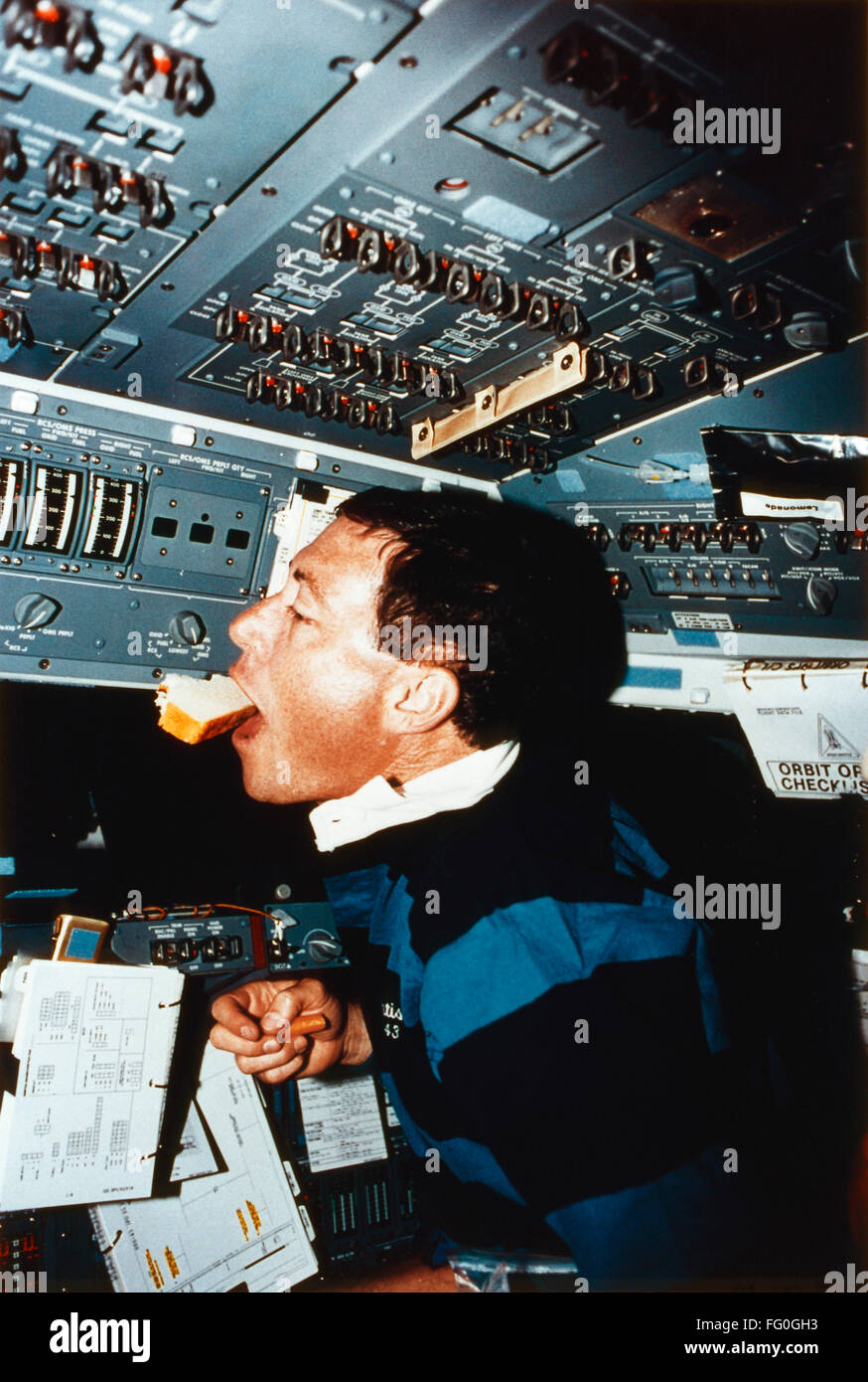 MICHAEL A. BAKER (1953- ). /nAmerican astronaut. Photographed eating a ...