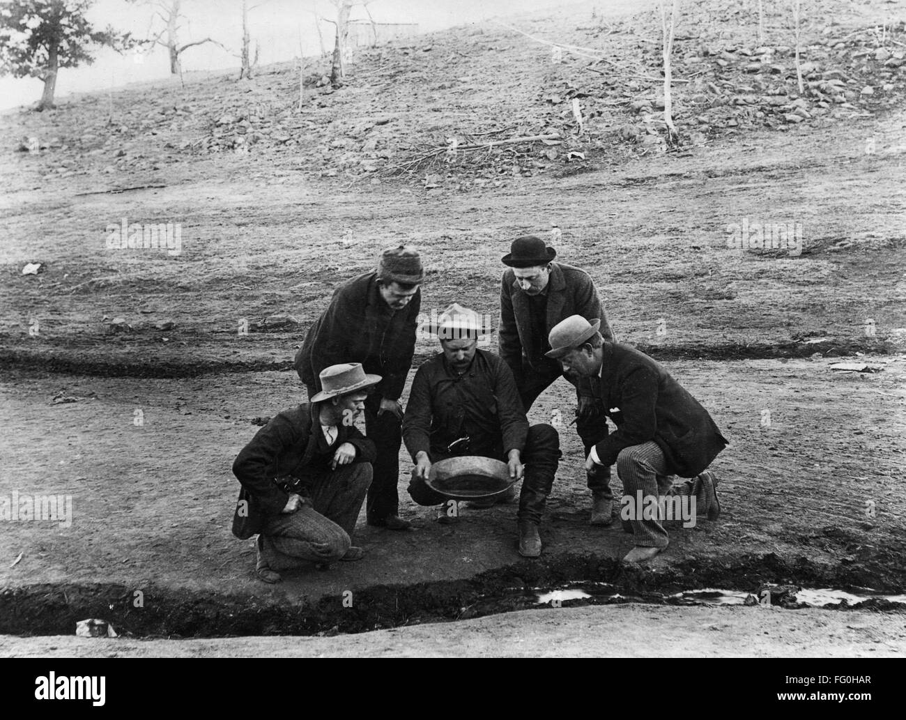 COLORADO: GOLD MINING, 1891. /nA group of men watching a placer miner ...