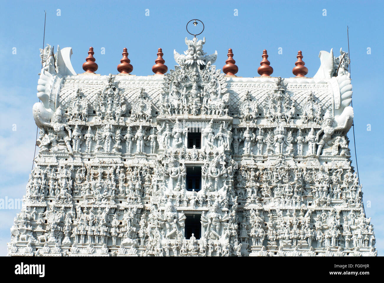 Gopuram of temple covered with sculpting richly decorated facade ...