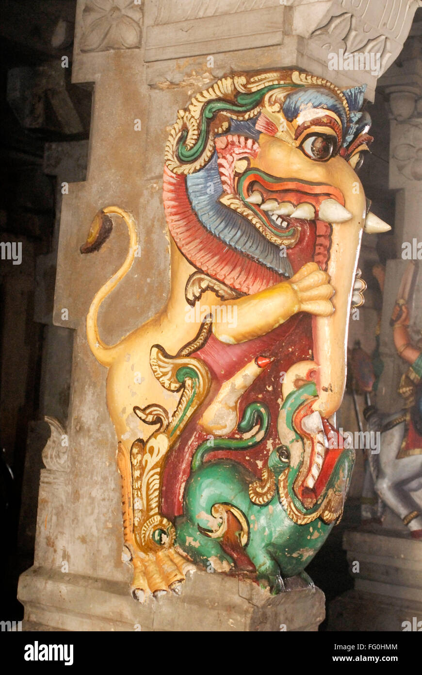 Richly carved and Colourfully painted fighting of mythological animals ...