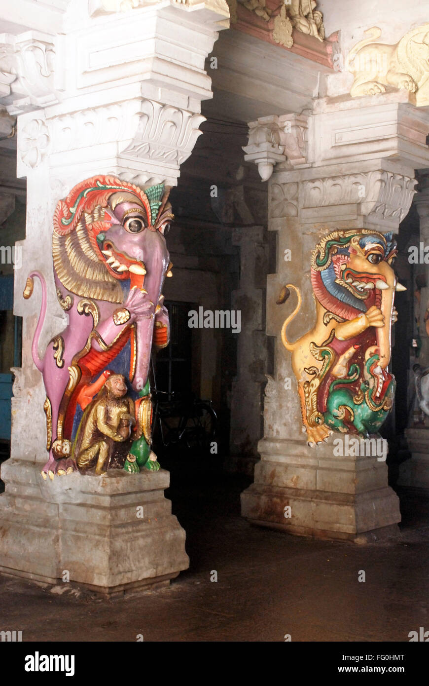 Richly carved and Colourfully painted fighting of mythological animals ...