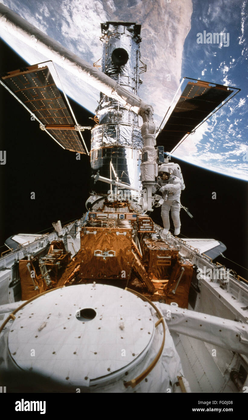 HUBBLE TELESCOPE, 1997. /nAstronaut Steven L. Smith works near the foot ...