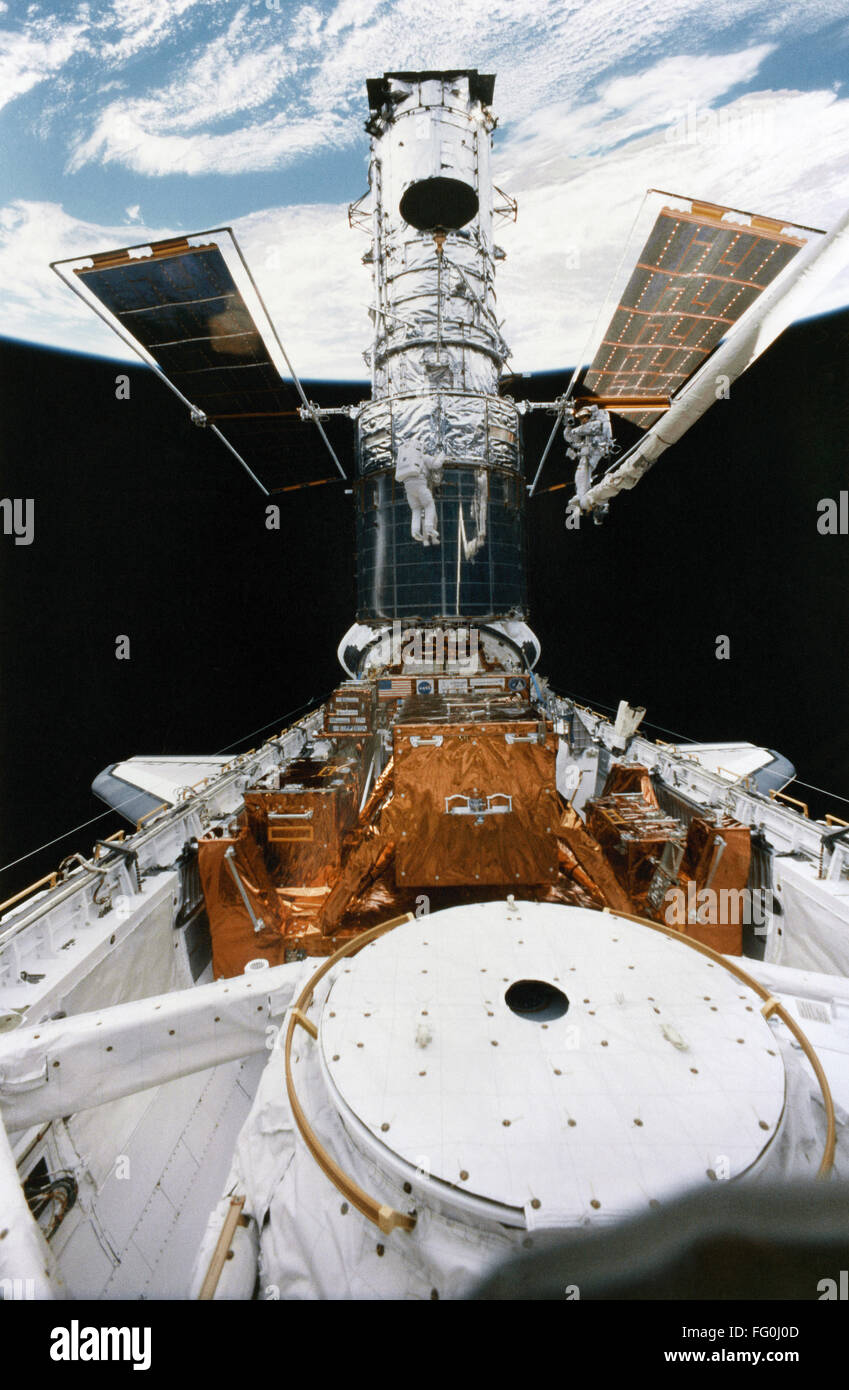 HUBBLE SPACE TELESCOPE. /nAstronauts Steven L. Smith (center) and Mark ...