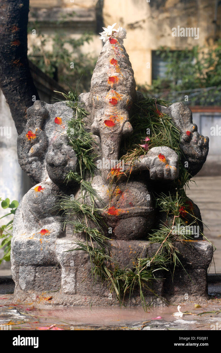 Statue of lord Ganesh Ganpati with garland of durva grass at Shree ...