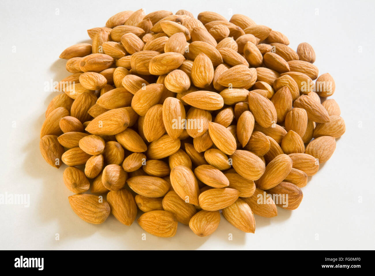 Dry fruit , whole Almonds nuts Badam Prunus dulcis on white background ...