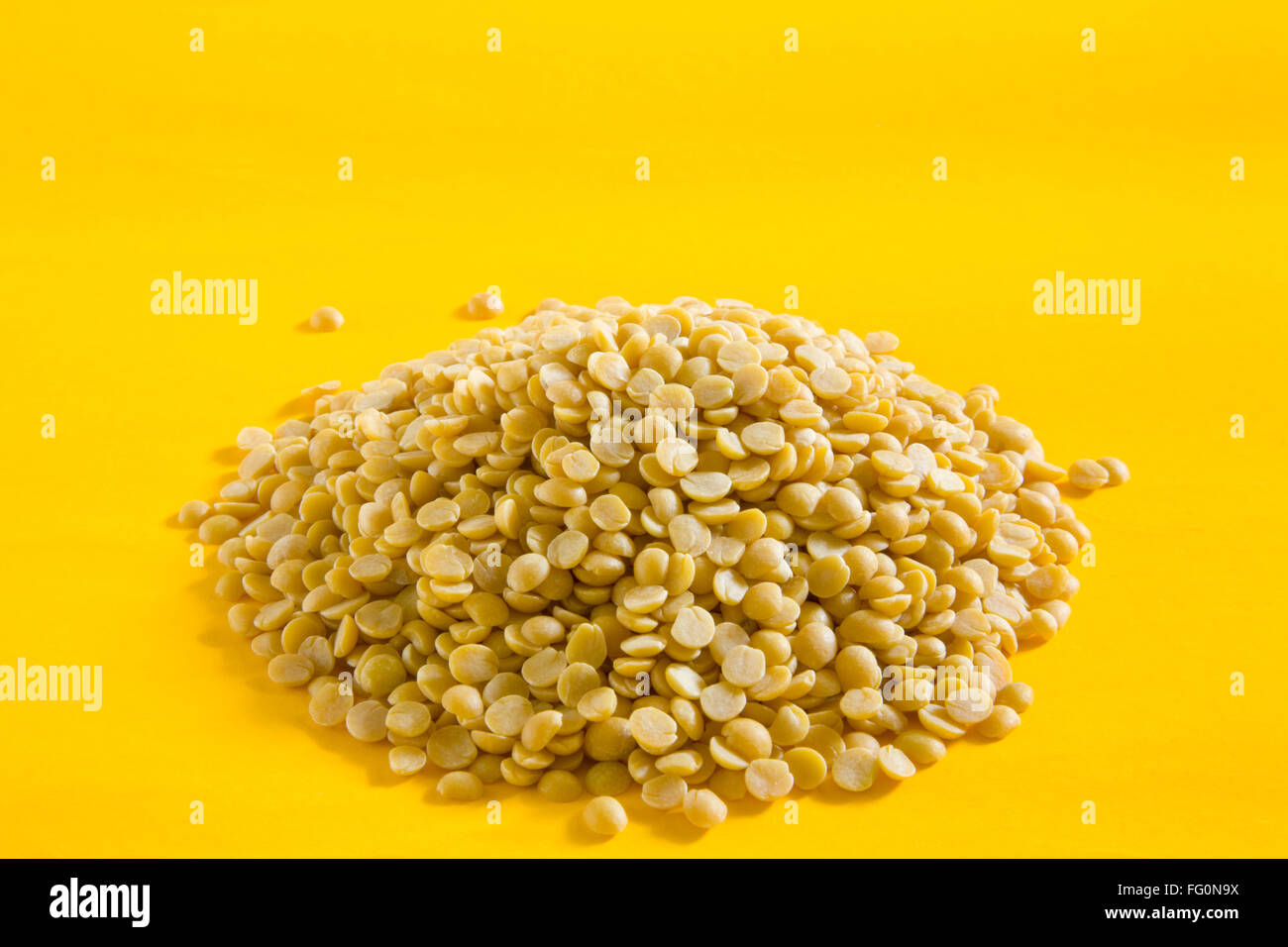 Pulses , split yellow lentils toor arhar dal lens culinaris on yellow ...