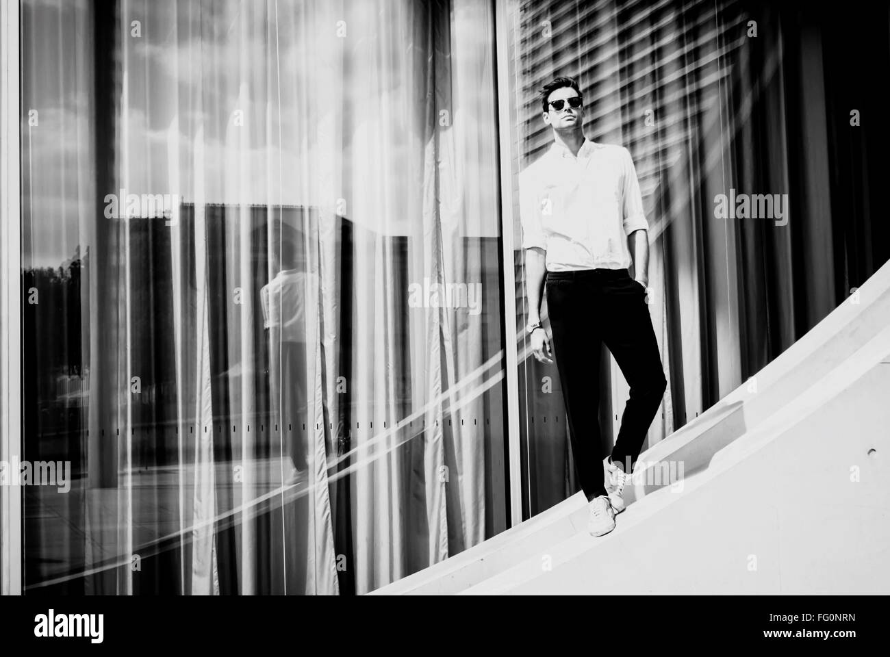 Young man reflection window Black and White Stock Photos & Images - Alamy