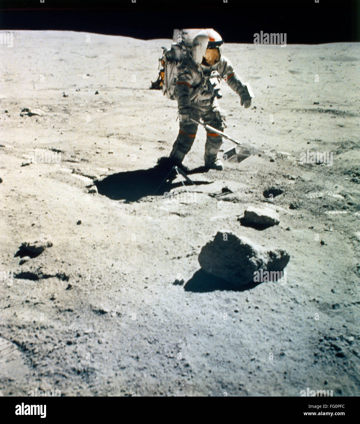 APOLLO 16: LUNAR RAKE, 1972. /nAstronaut John Young collecting samples ...