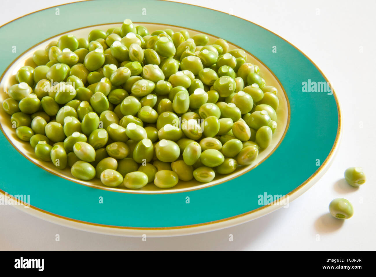 Fresh green unpeel lentils toor arhar dal lens culinaris in plate Stock ...