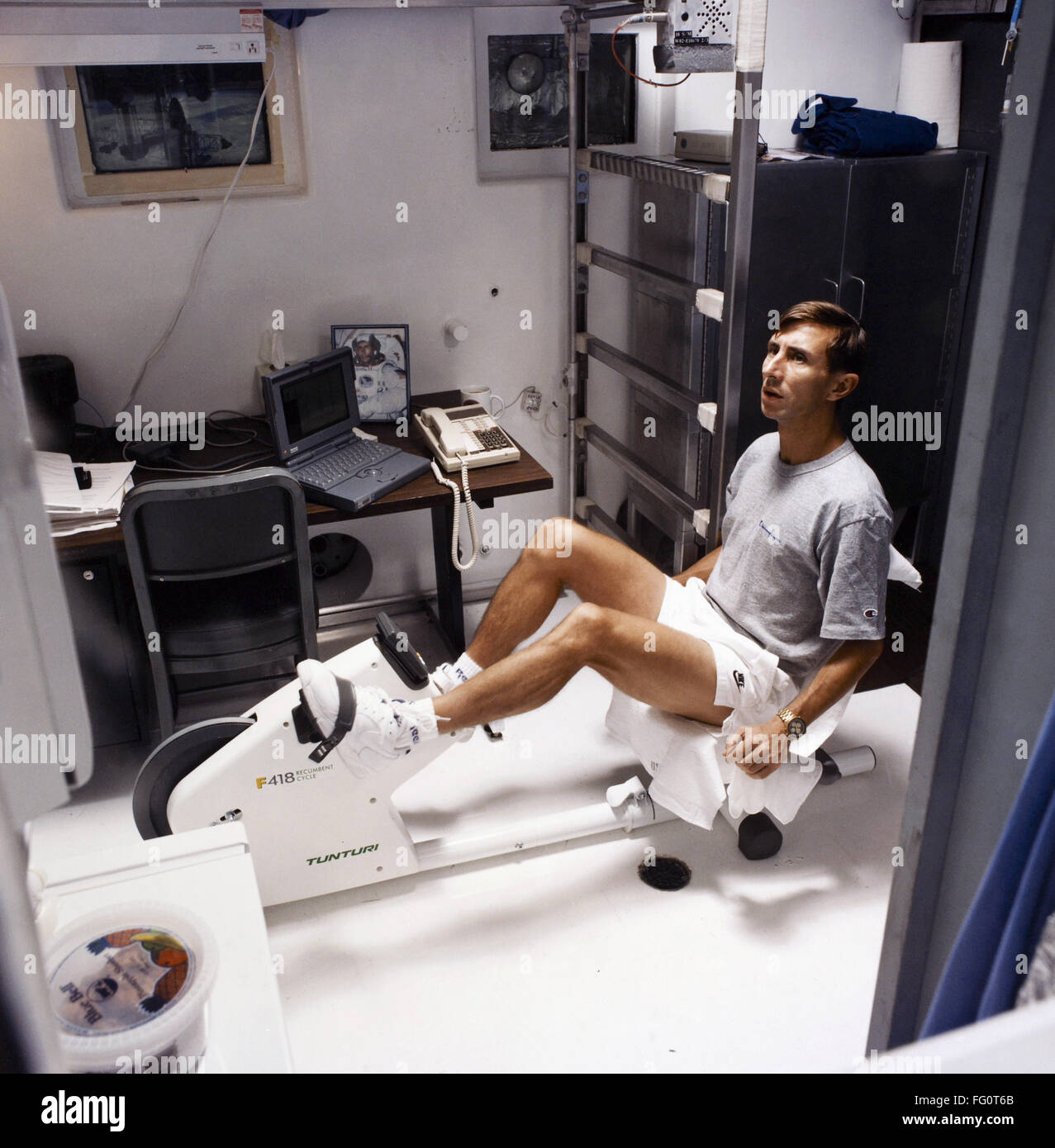 SPACE: RESEARCH, 1996. /nDoctor Nigel Packham on a bicycle in an ...