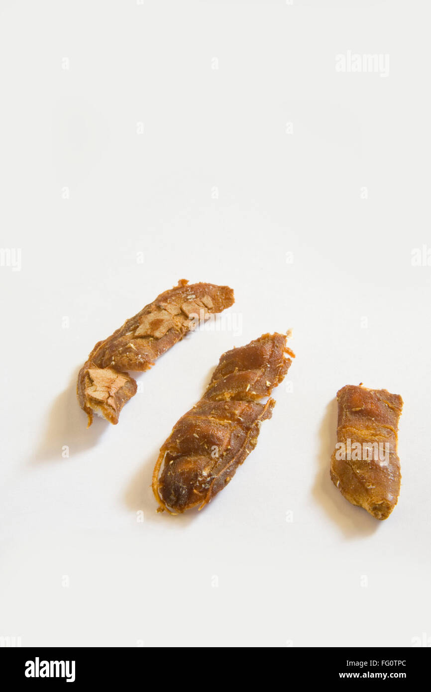 Indian spice , Tamarind imli Tamarindus indica on white background ...