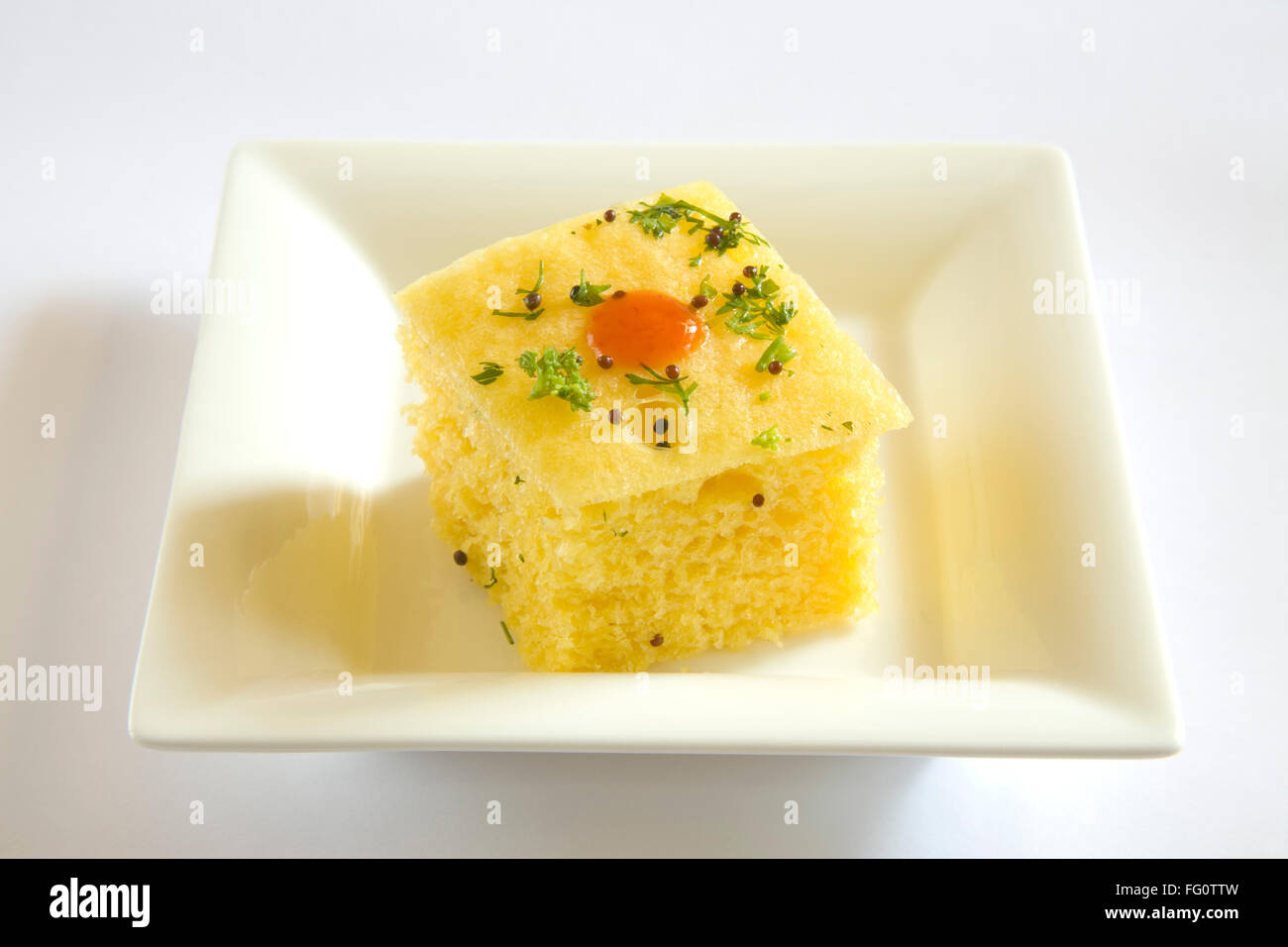 Indian cuisine , fast food Dhokla served with tomato ketchup in dish on ...