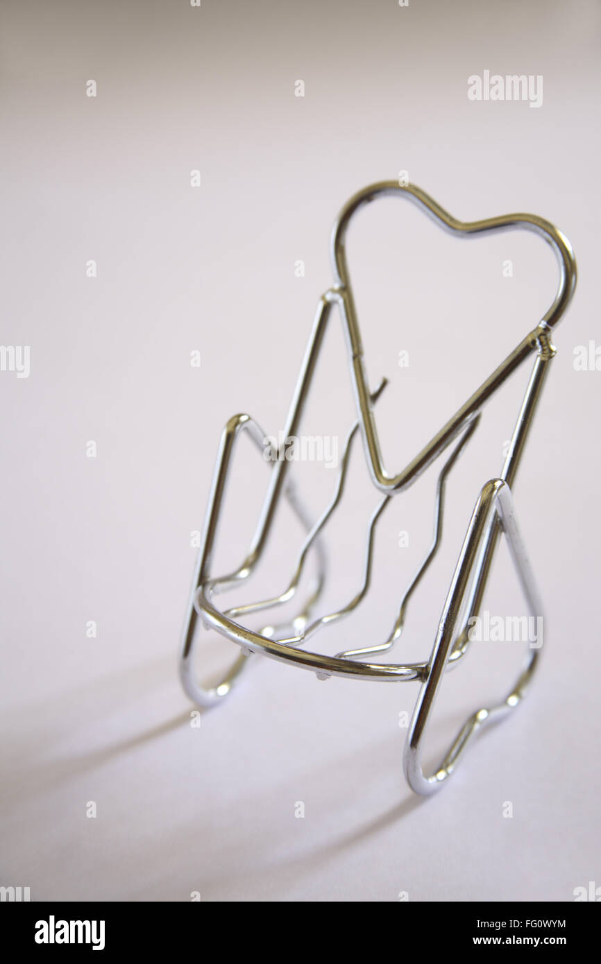 Concept , showpiece gift stainless steel relax chair Stock Photo - Alamy