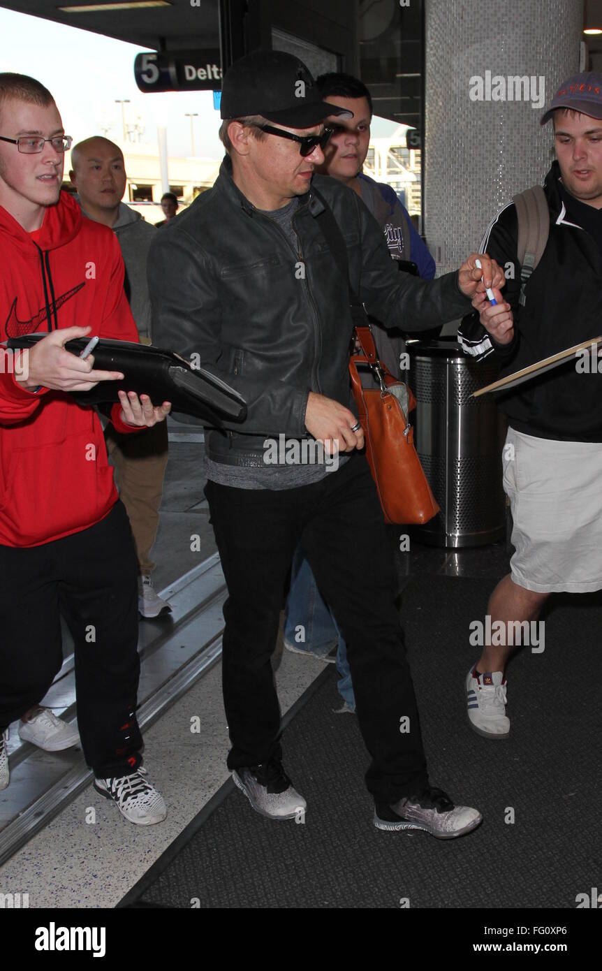 Jeremy Renner signs autographs for fans as he departs from Los Angeles ...