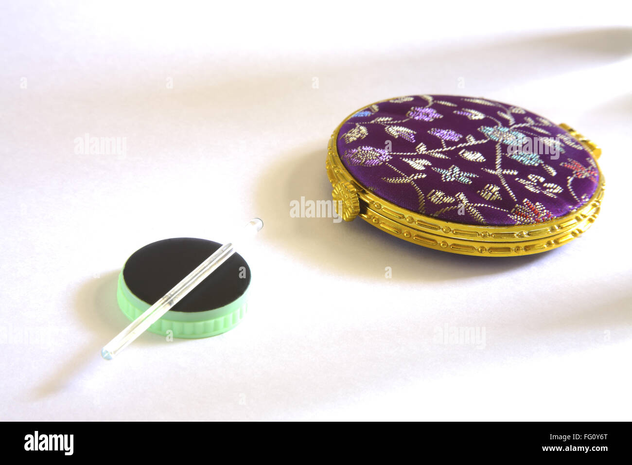 Concept , anjan or kajal shalaka thin rod glass with collyrium applied ...