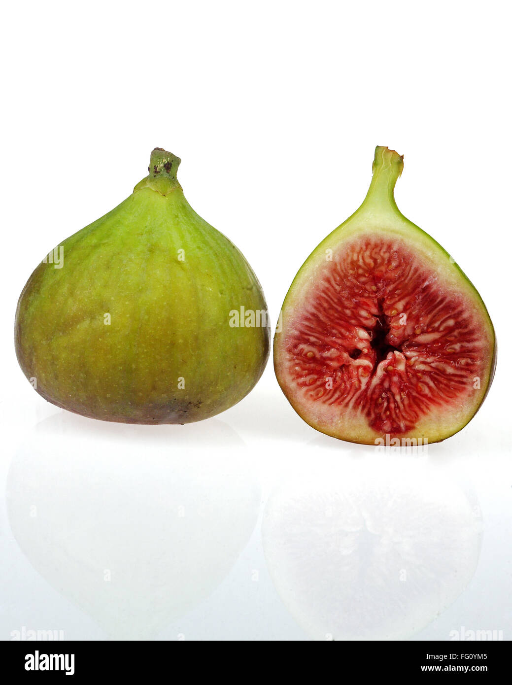 Fig , Anjir one full and one cut on white background Stock Photo - Alamy