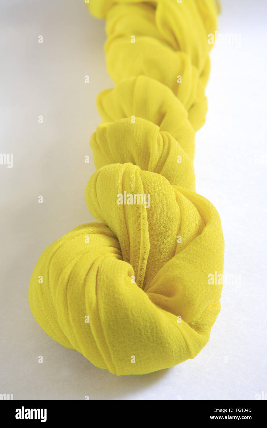 Concept , fabric turn twist on white background Stock Photo - Alamy