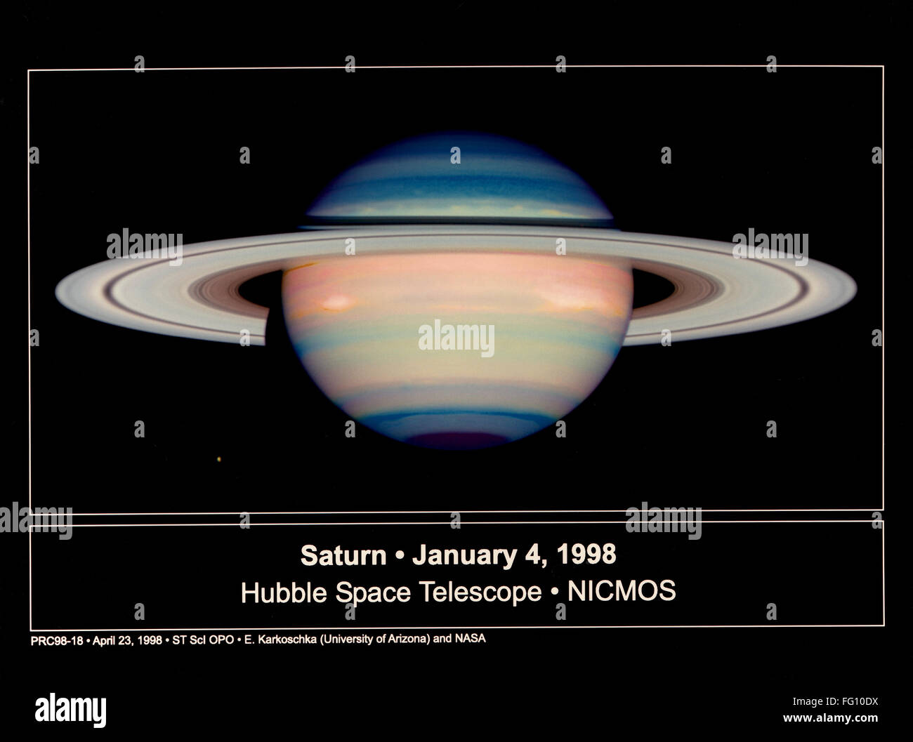 SATURN, 1998. /nFalse-color view of Saturn and the moons Dione (lower ...