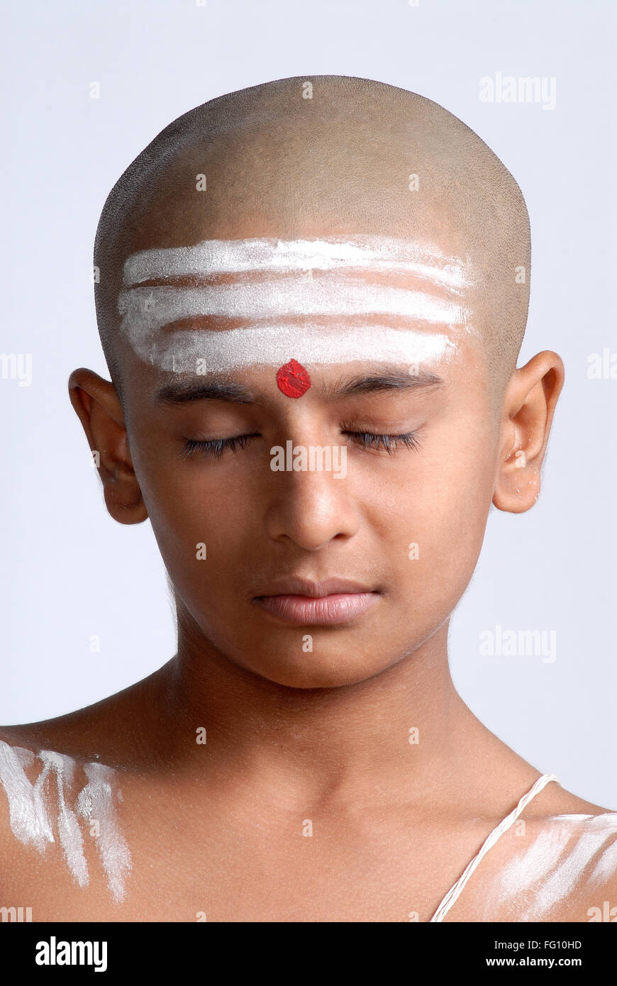 Indian Hindu bald boy with red tilak white shaivite symbol on forehead ...