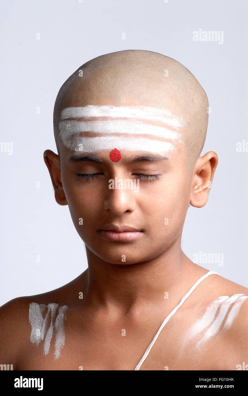 Indian Hindu bald boy with red tilak white shaivite symbol on forehead ...