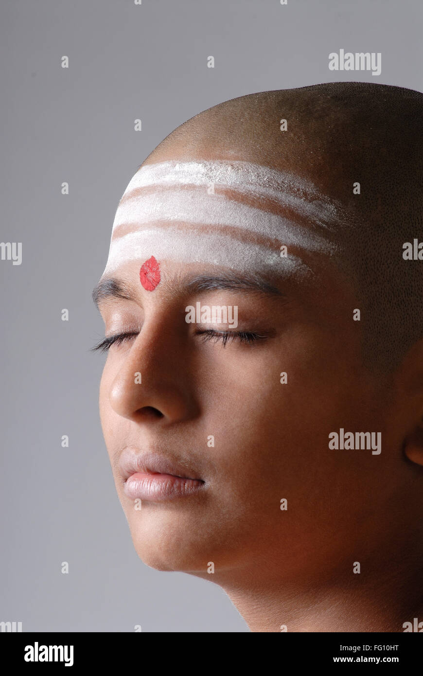Indian Hindu bald boy with red tilak white shaivite symbol on forehead ...