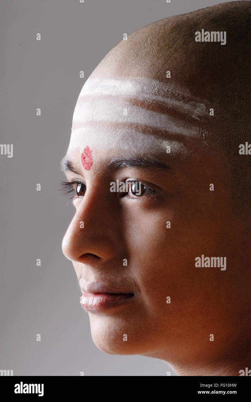 Indian Hindu bald boy with red tilak white shaivite symbol on forehead ...