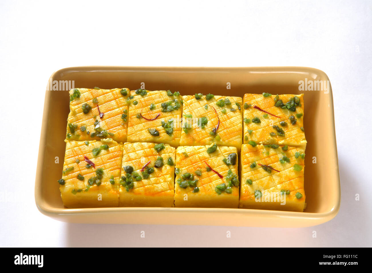 Indian sweet , sandesh bengali mithai garnish with pistachio and ...