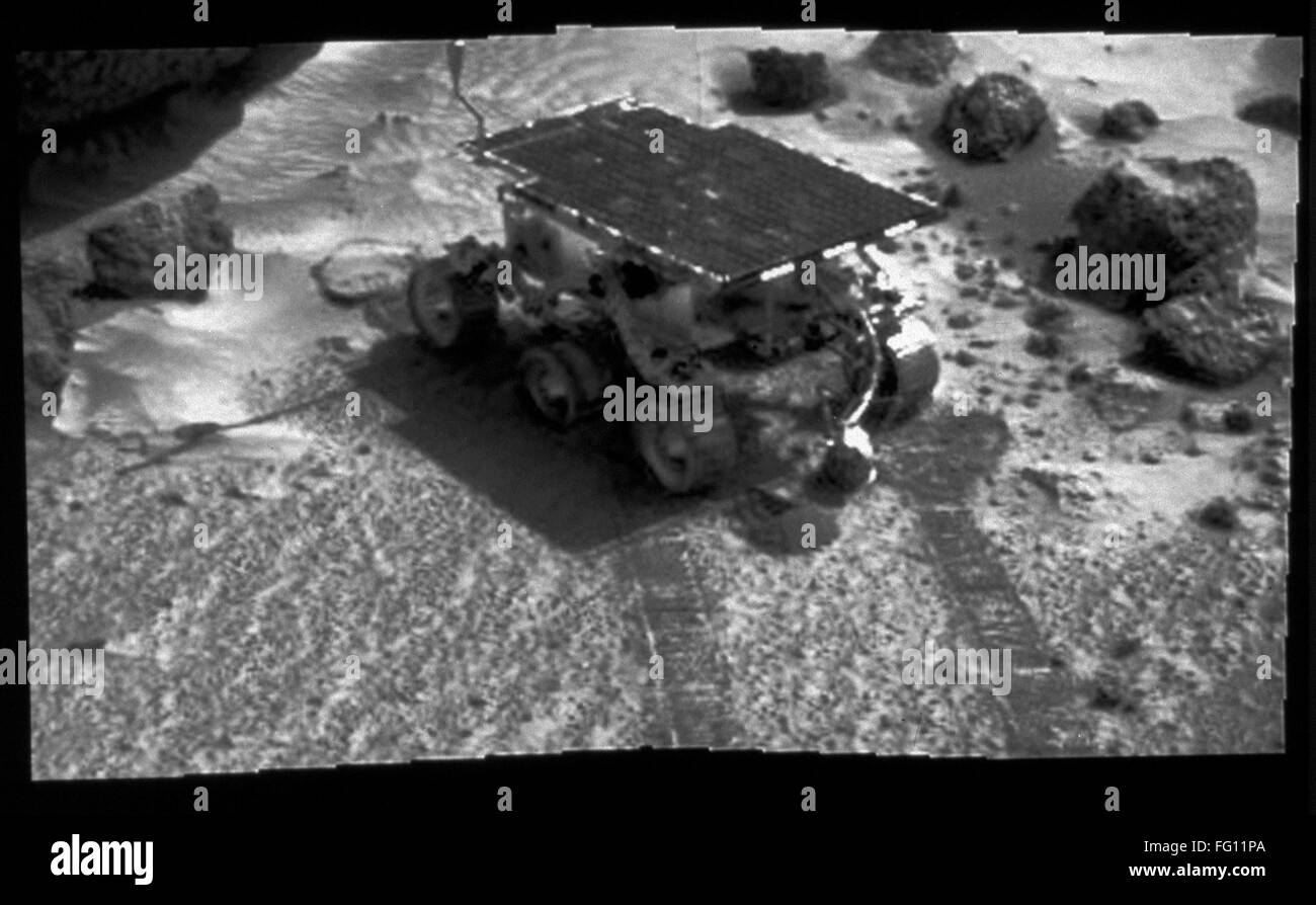 MARS: SOJOURNER, 1997. /nThe Sojourner rover studying rocks on the ...