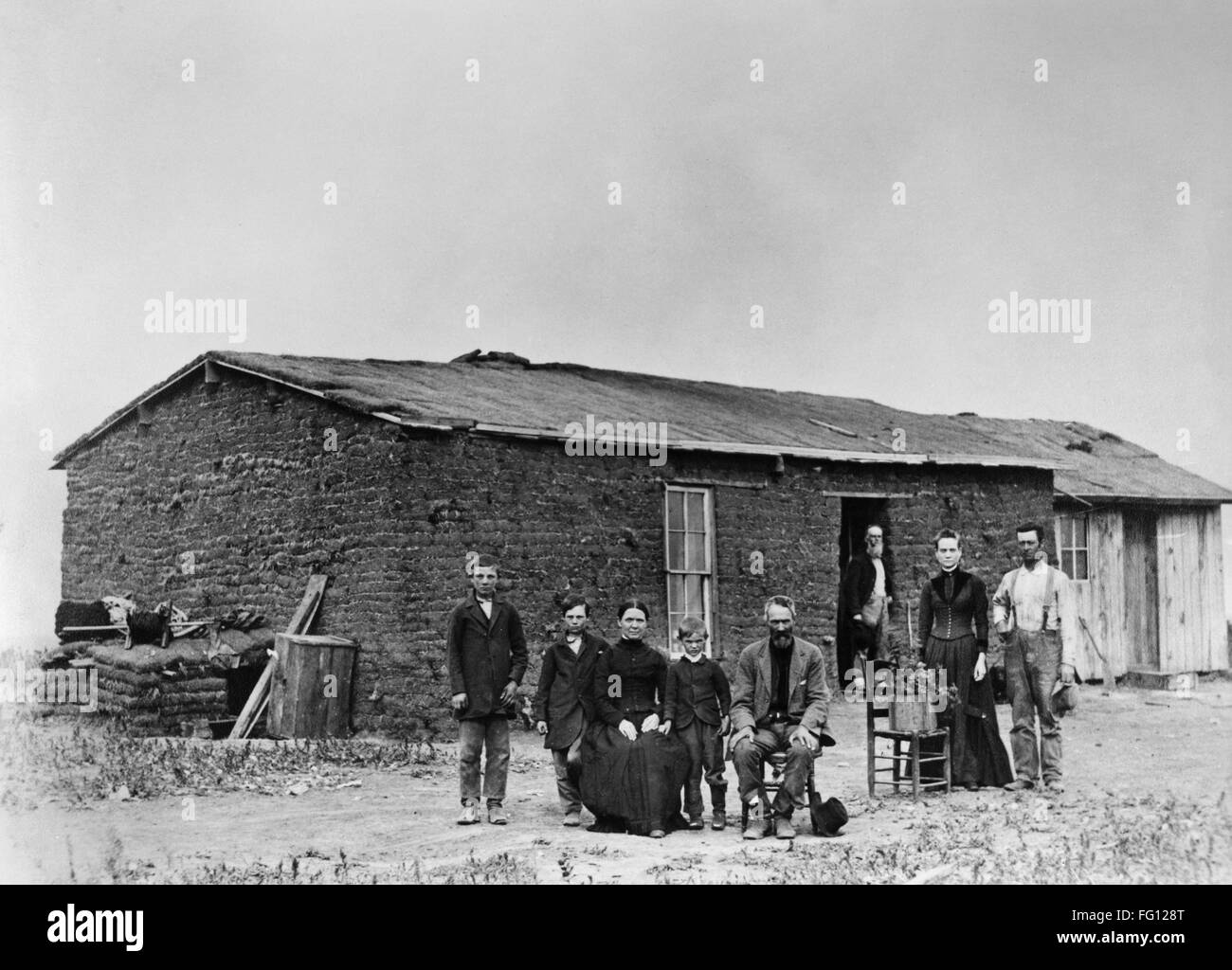 SOD HOUSE, c1880. /nA homesteader family in front of their sod house ...