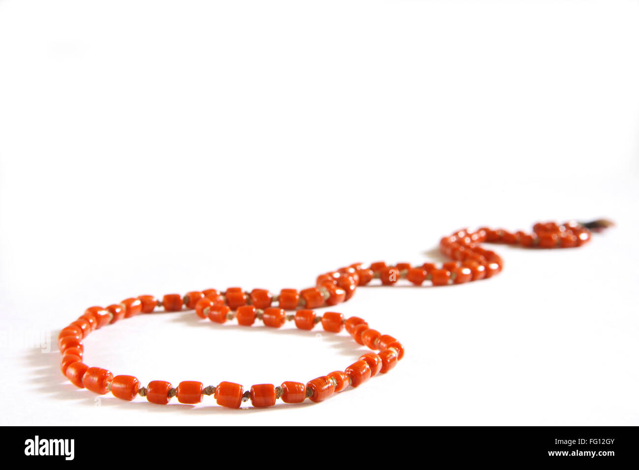 Concept ; munga mala coral used in rosary on white background Stock ...