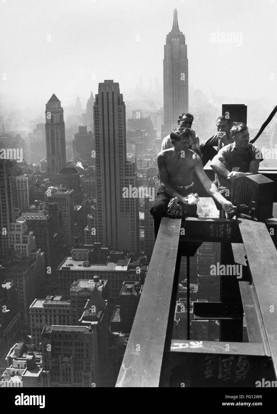 RCA BUILDING, 1932. /nSteelworkers listening to the radio and having ...