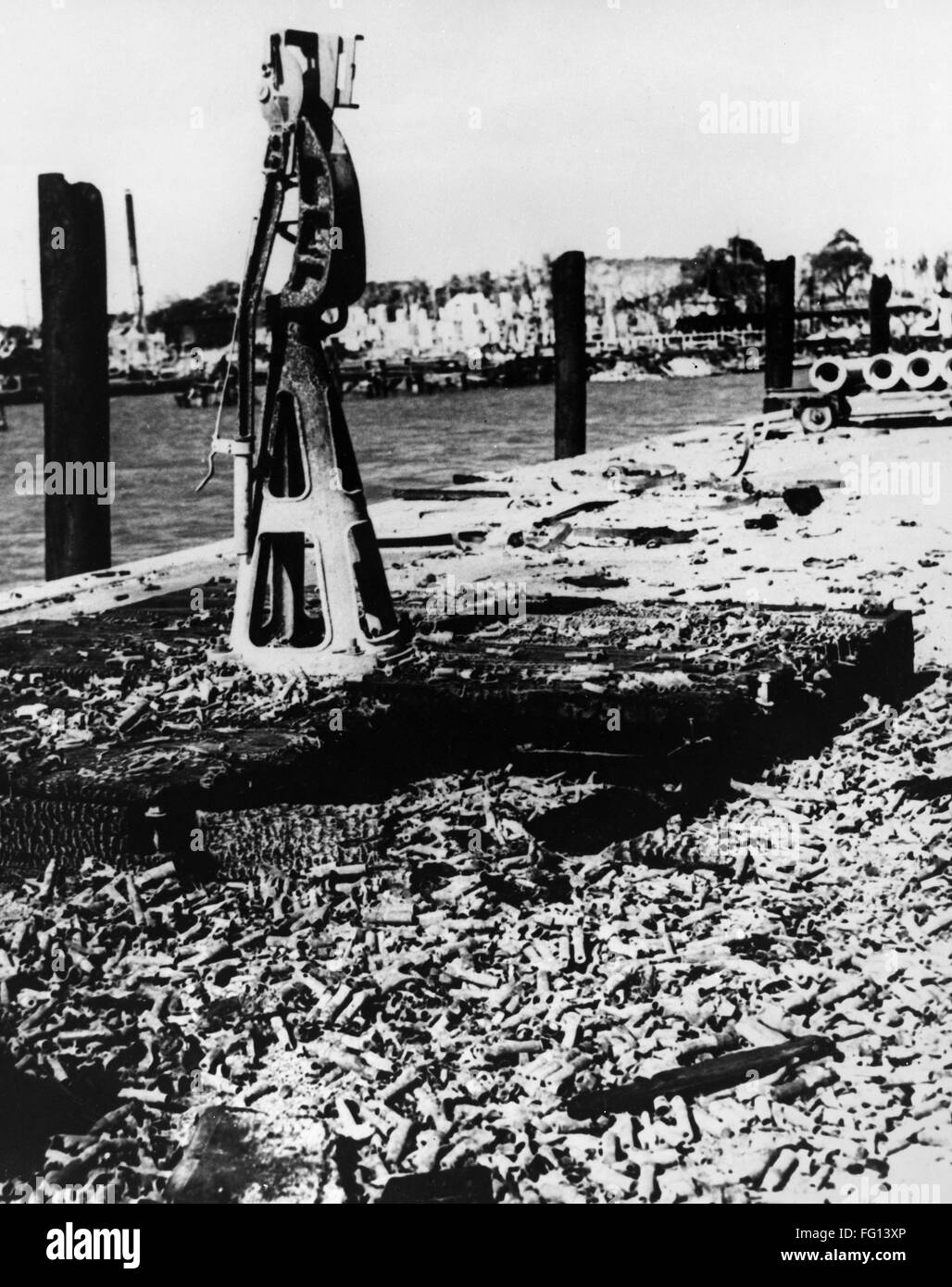 WWII: CAVITE NAVY YARD, 1941. /nA burned out anti-aircraft machine gun ...