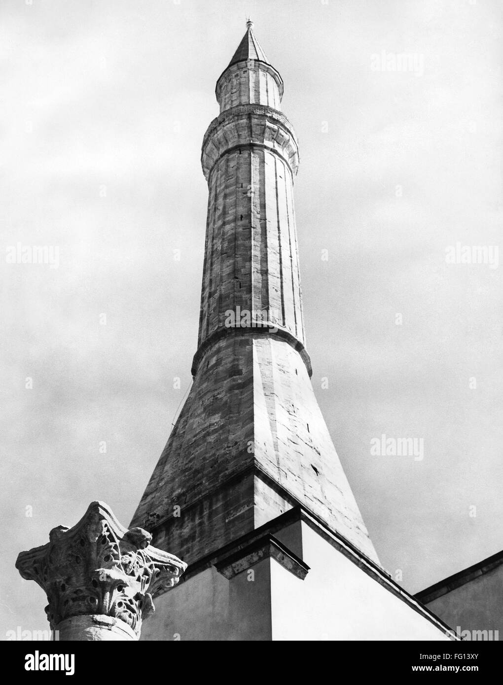 ISTANBUL: MINARET & COLUMN. /nA minaret of a mosque towers over an ...