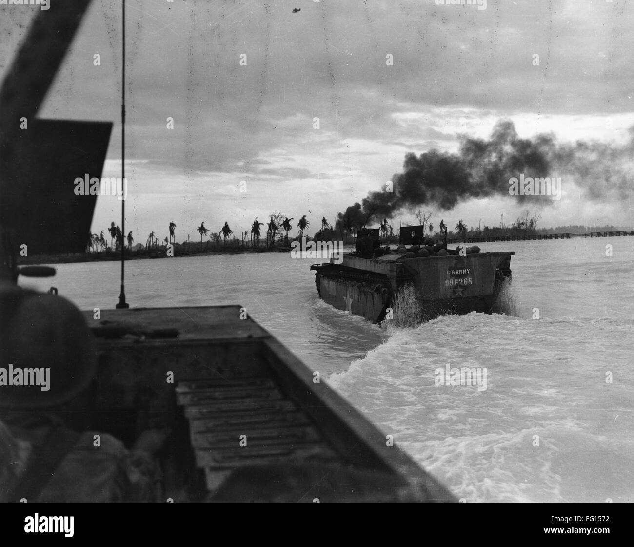 WWII: PELELIU, 1944. /nAmerican amphibious tanks landing on Ngesebus ...