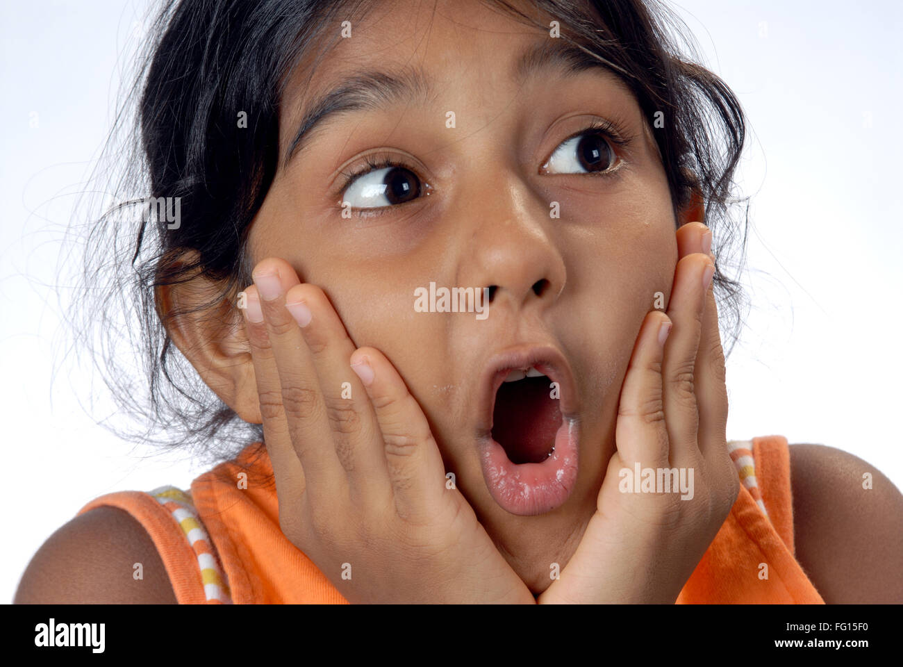 South Asian Indian girl shocked opened mouth with two hands on cheek MR ...