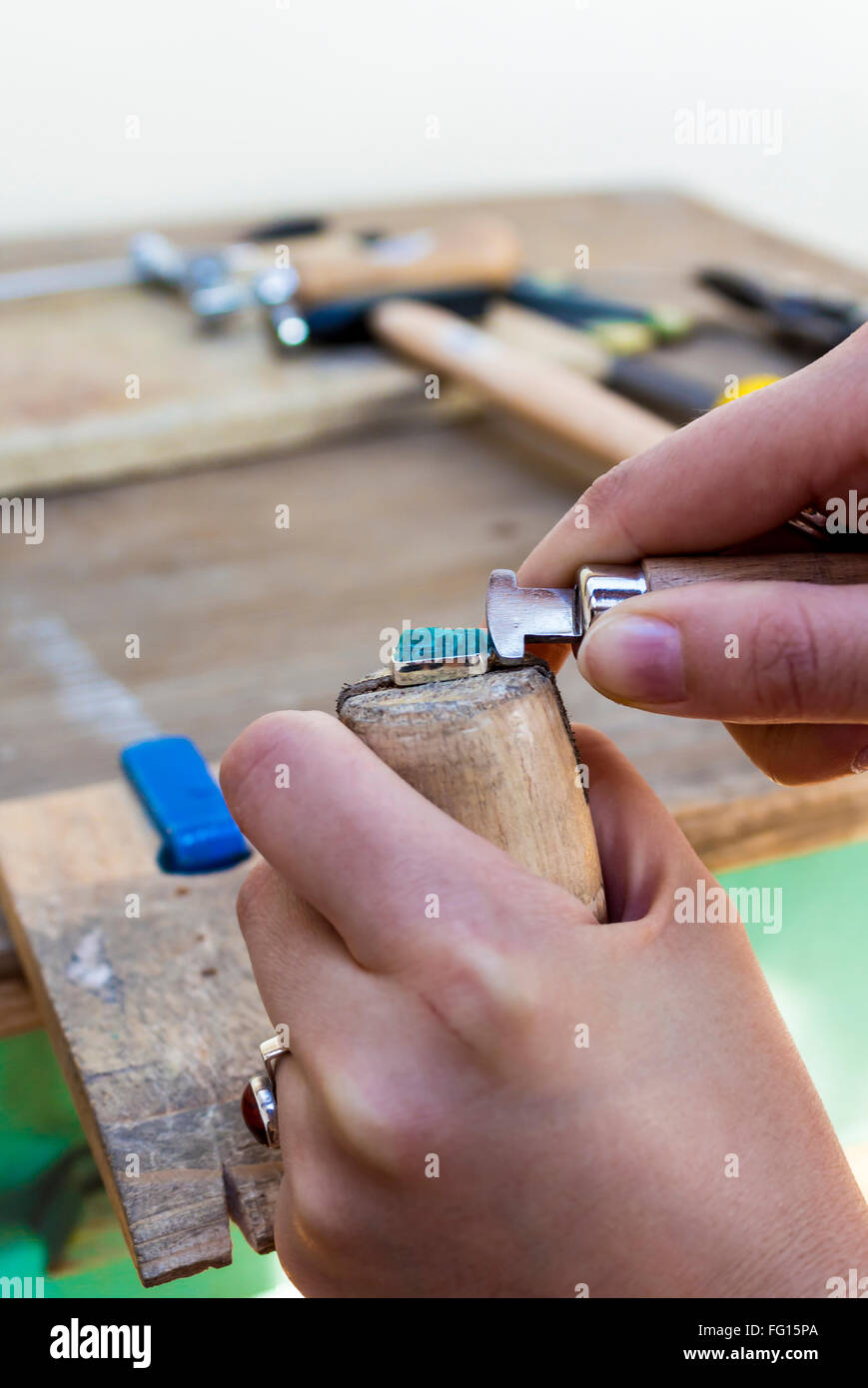 Stonesetting a rough amazonite gemstone using a ring clamp and a ...