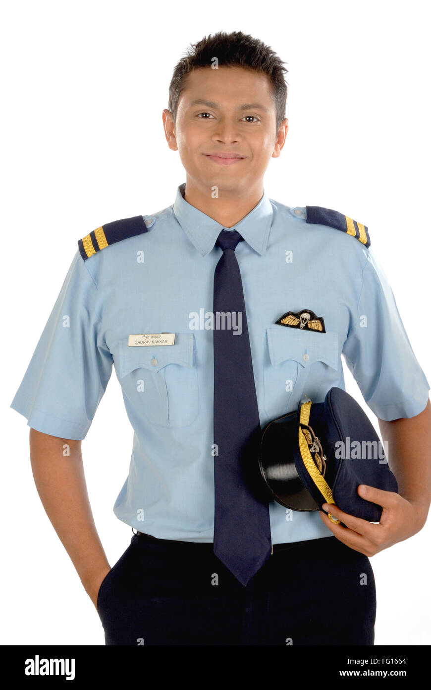 Pilot holding cap in hand MR#782W Stock Photo - Alamy