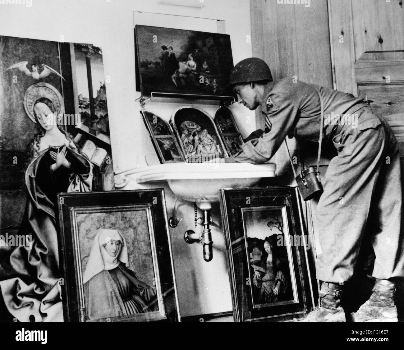 WORLD WAR II: STOLEN ART. /nAn American soldier examining works of art ...
