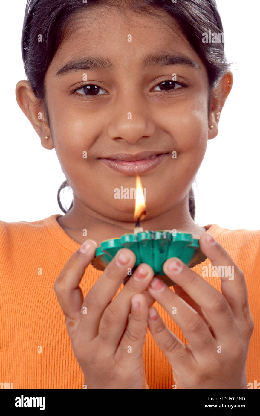 South Asian Indian girl holding deepak oil lamp welcome to guest on ...