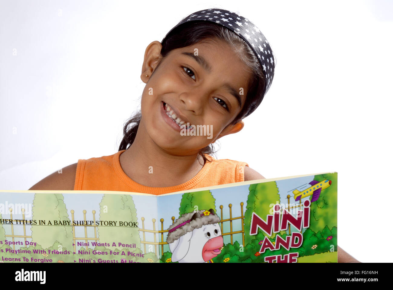 Asian girl reading comic book hi-res stock photography and images - Alamy