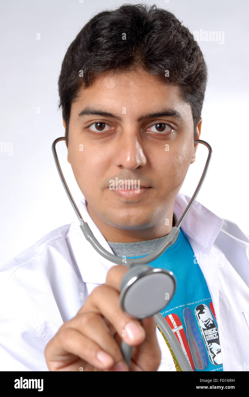 South Asian Indian doctor with stethoscope examine patient MR#628 Stock ...