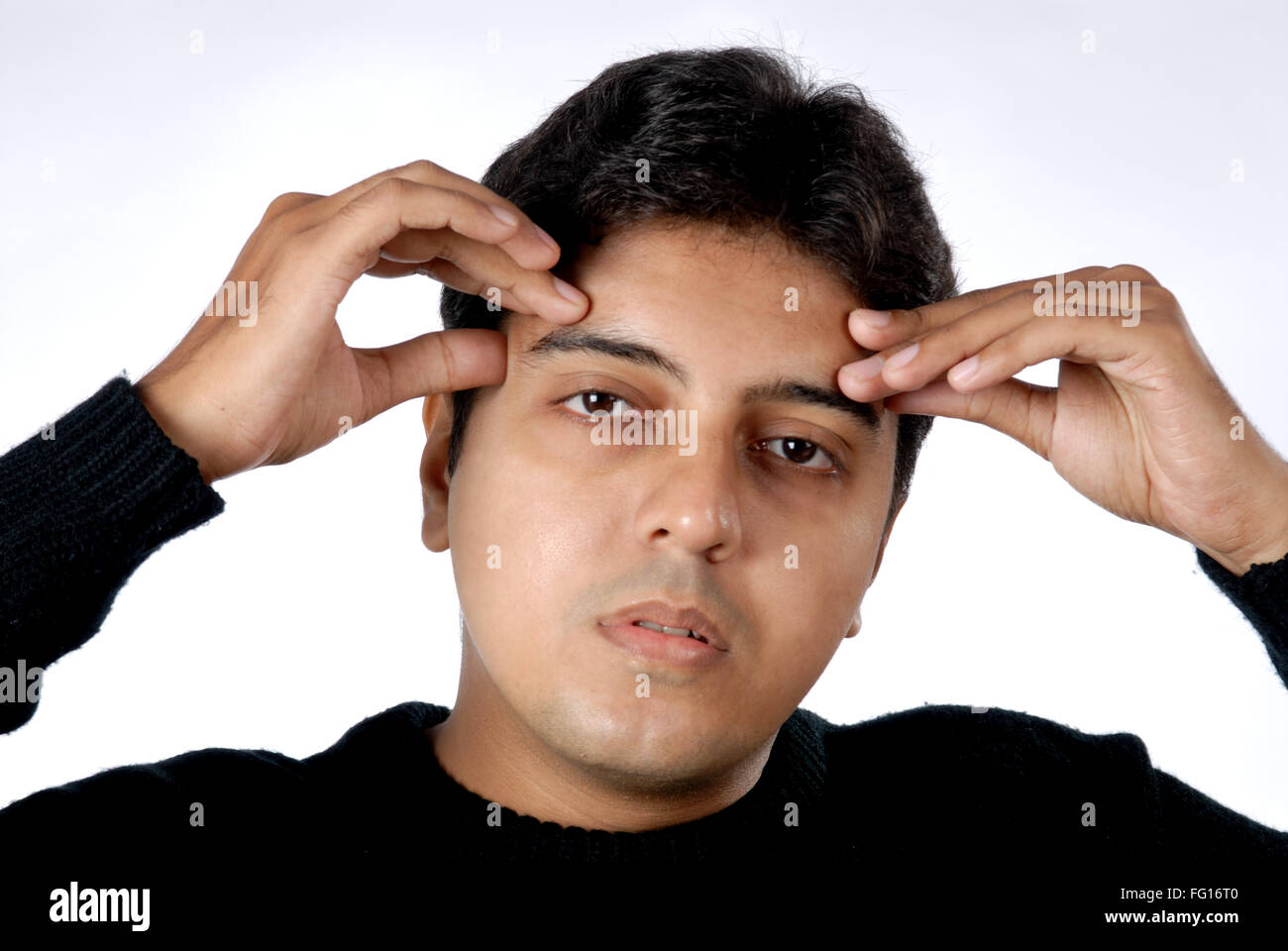 South Asian Indian man suffering from pain full headache MR#628 Stock ...