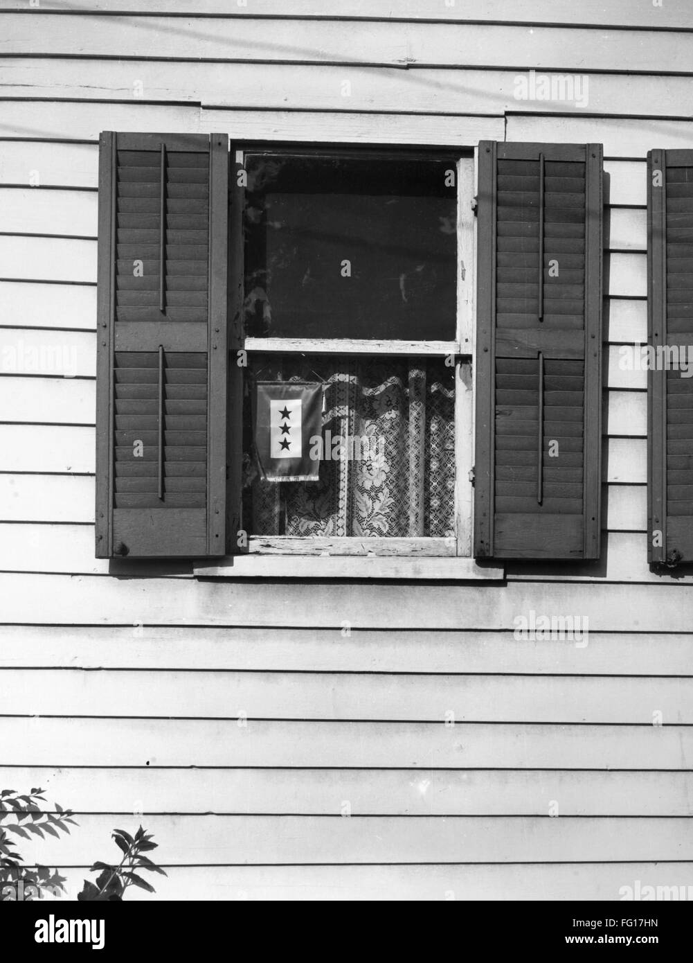 WWII: HOMEFRONT, 1943. /nA service flag in the window of a home in ...