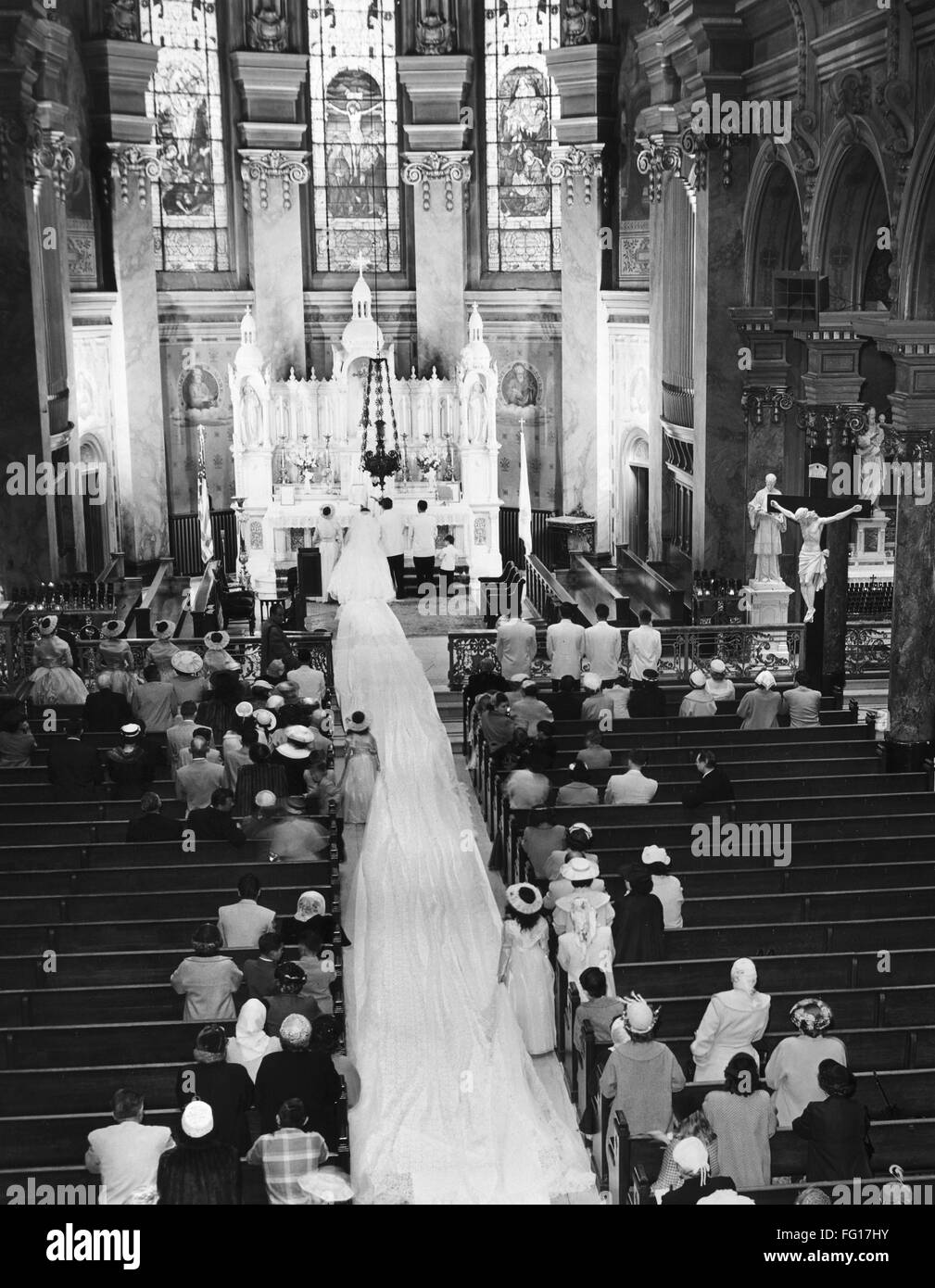 WEDDING, 1957. /nRita Fullam, 24, wearing a $10,000 wedding gown with a ...